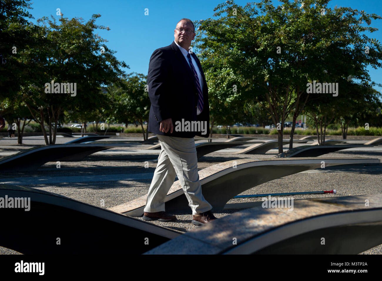 Retired Navy Chief Petty Officer Michael Pendergrass looks upward ...