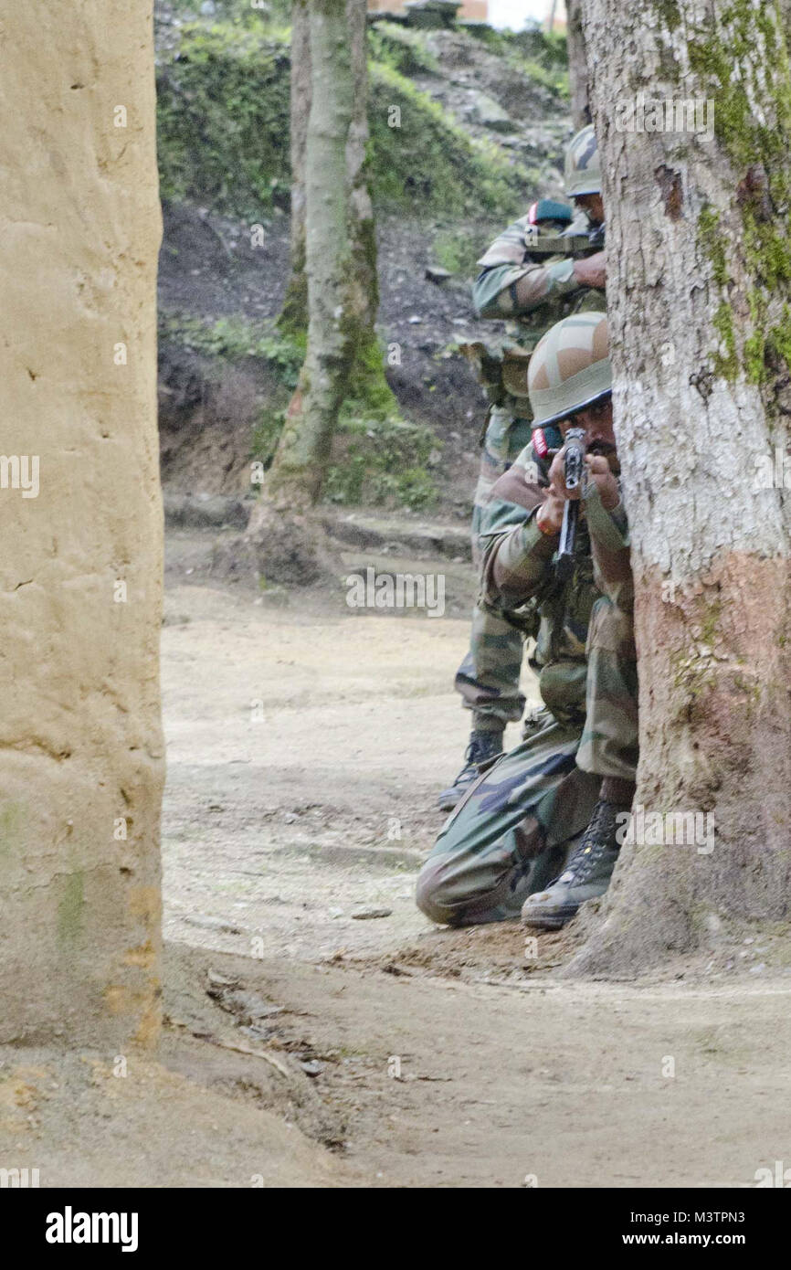 An Indian soldier with 12 Madras pulls security in a cordon and search ...