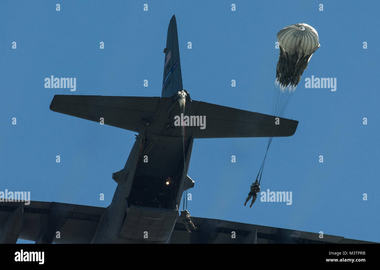 Joint Communication Support Element (JCSE) operators jump from a C-130 ...