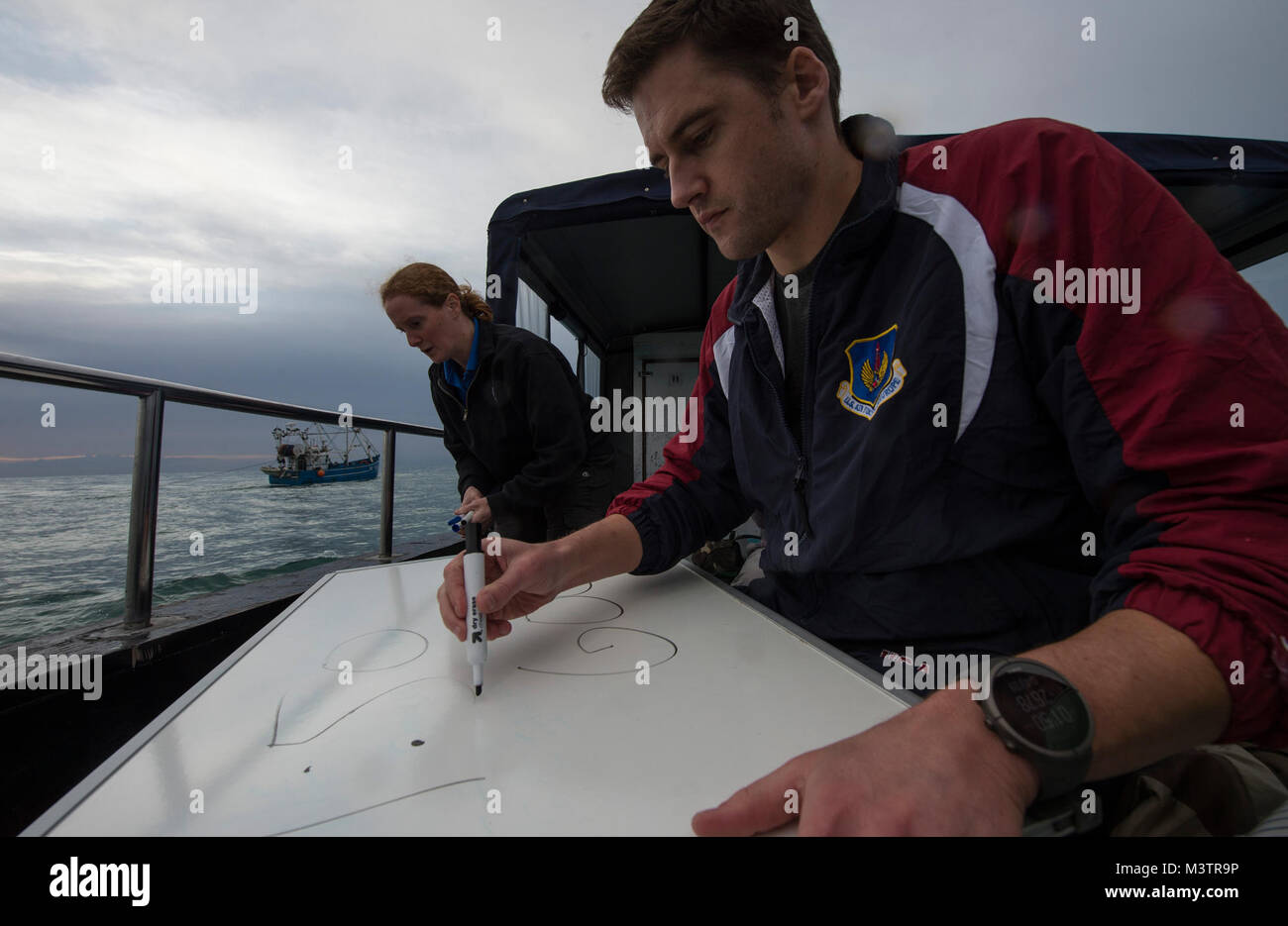 U.S. Air Force Major Simon Ritchie, a dermatologist with the 59th ...