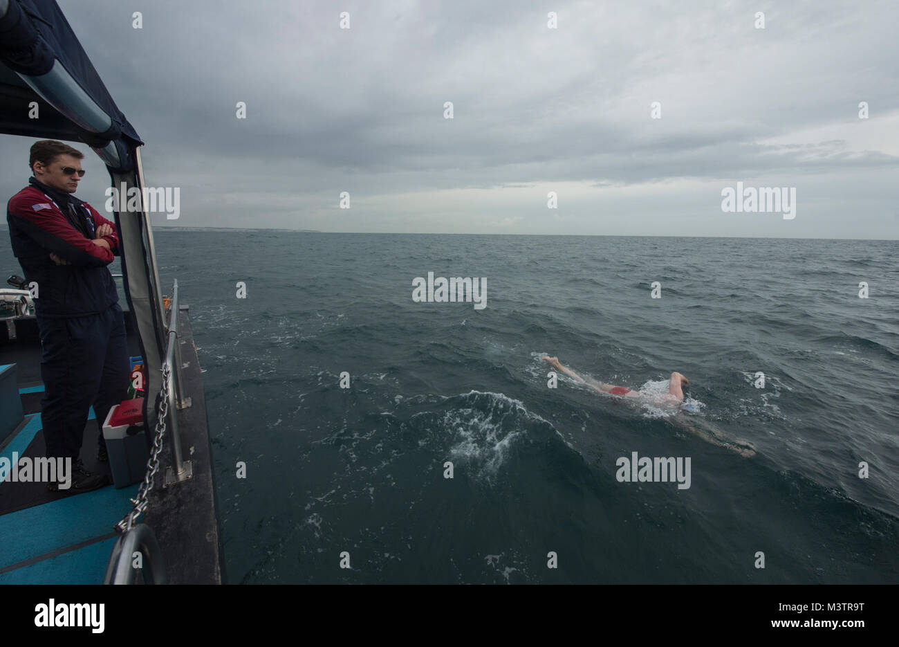 U.S. Air Force Major Simon Ritchie (left), a dermatologist with the ...