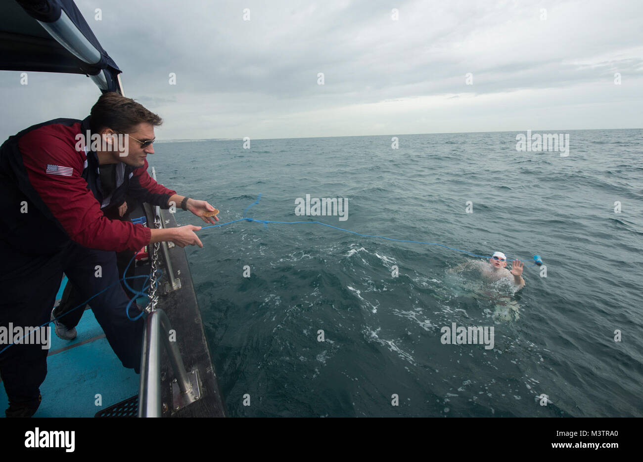 U.S. Air Force Major Simon Ritchie (left), a dermatologist with the ...