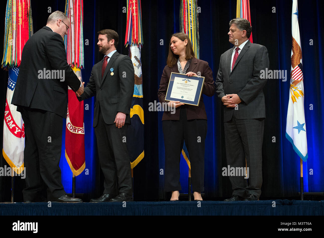 Deputy Defense Secretary Bob Work, left, congratulates David Wiltse of ...