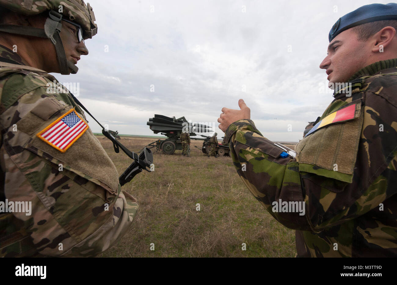 Defense Artillery Regiment, speaks with Romanian Air Force 1st ...