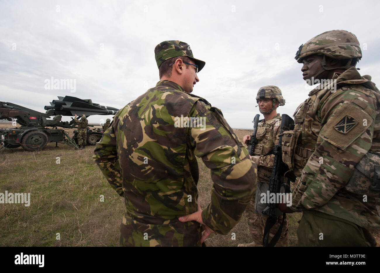 An officer with the Romanian Air Force converses on “Hawk” missile ...