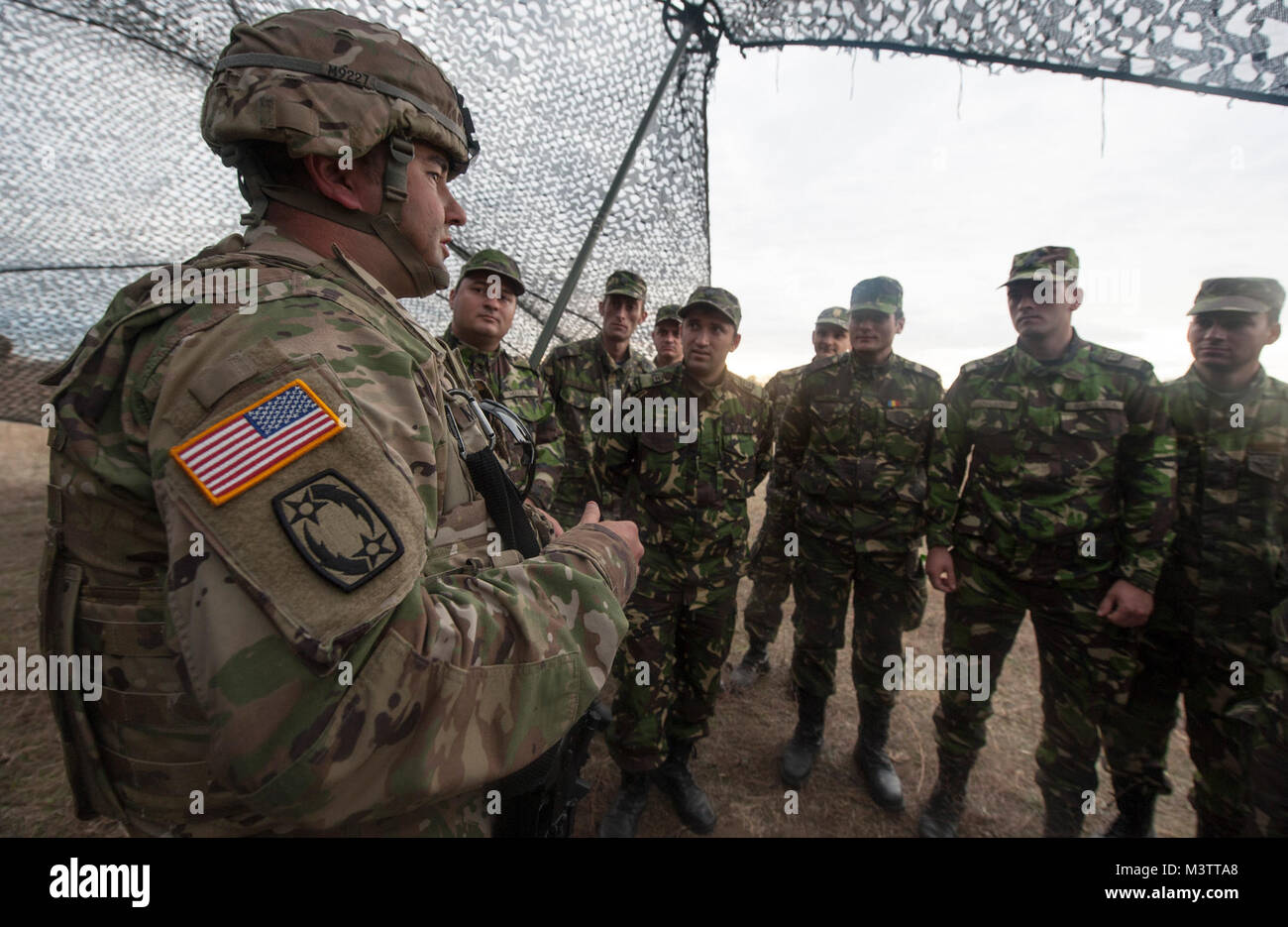 U.S. Army Staff Sgt. Ryan McGroarty (left), a Soldier with the 5th ...