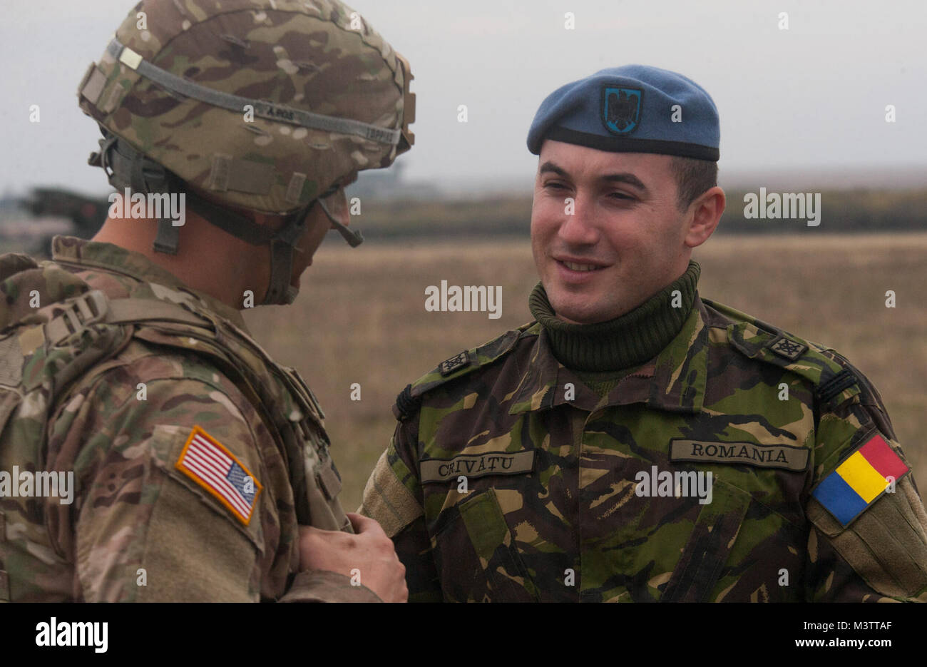 U.S. Army Captain Michael Topping (left), with the 5th Battalion, 7th ...