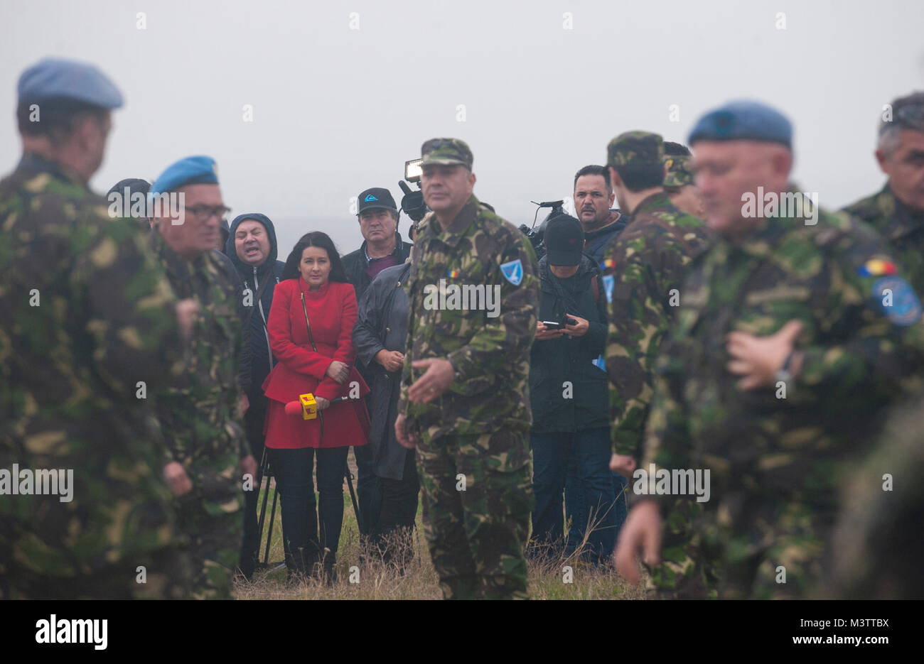 Romanian press gather together and wait to interview a Member of the ...