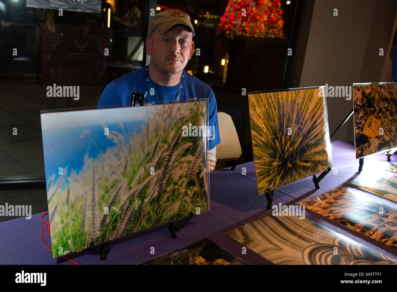 Veteran Dave Long sits for a portrait at his art table featuring his ...