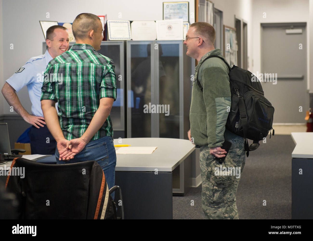 Staff Sgt. Geoffrey Moshier speaks with Lt. Col. Alexander L. Ackerman ...