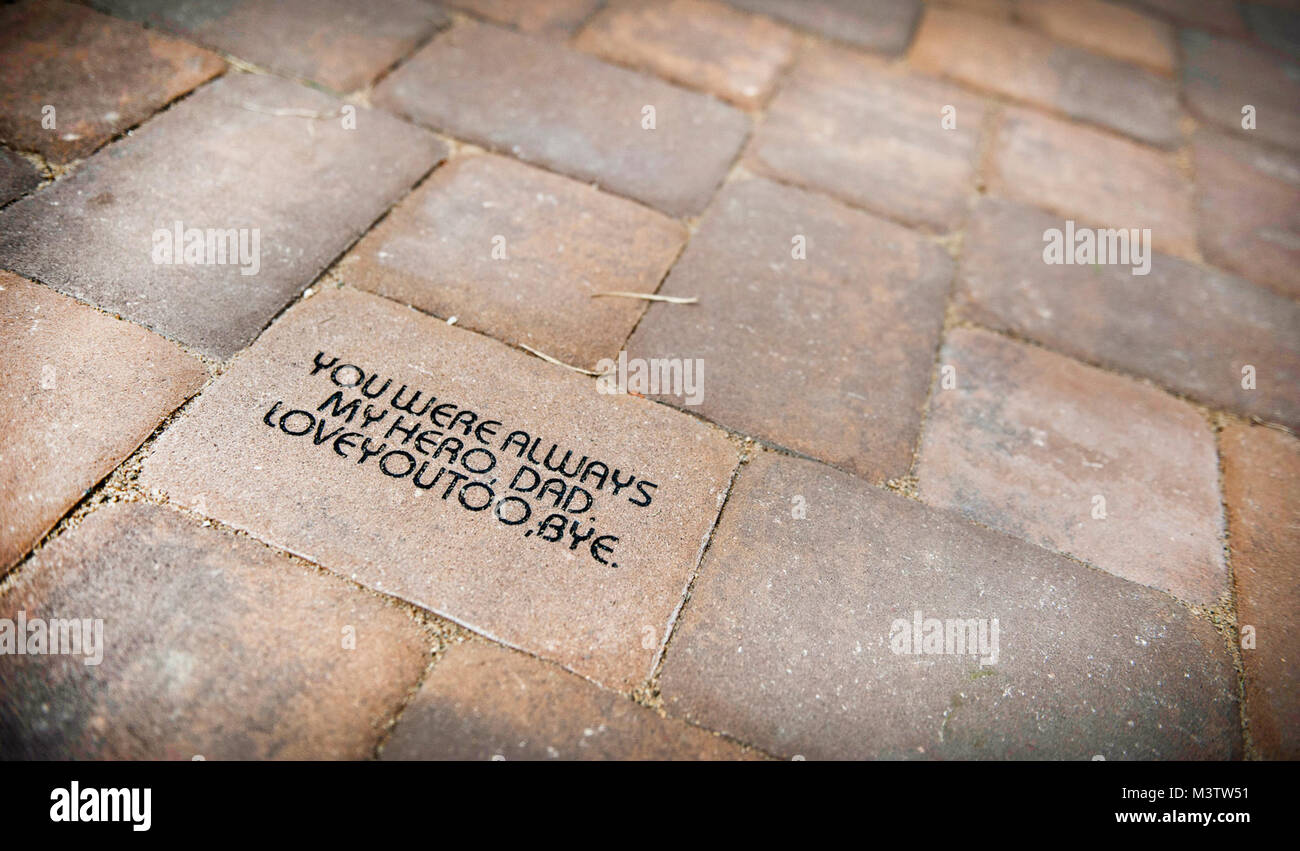 Family members wrote messages for their fallen loved ones on paver ...