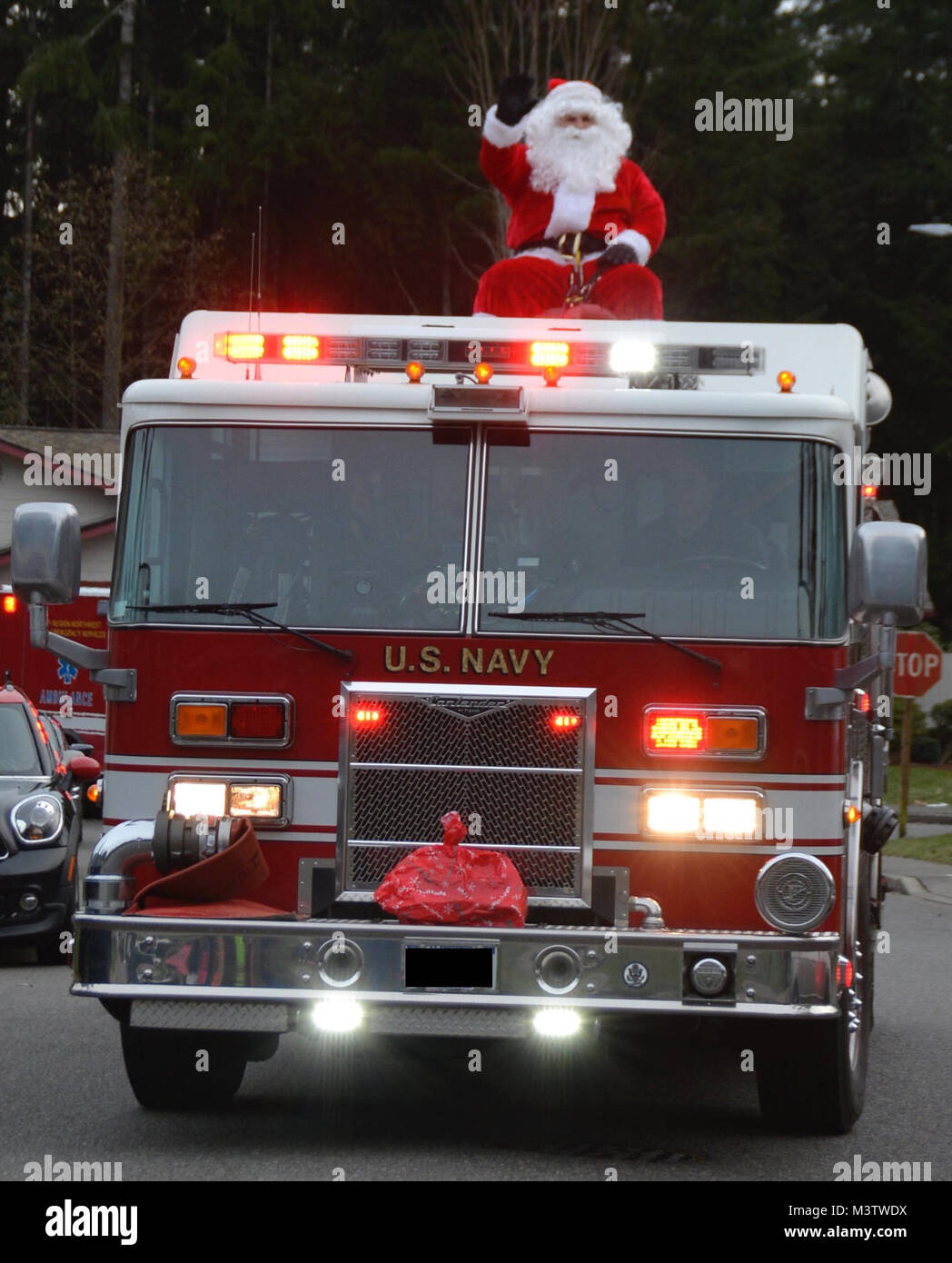 161218-N-UQ990-012 SILVERDALE, Wash. (Dec. 18, 2016) – Santa Claus gets ...