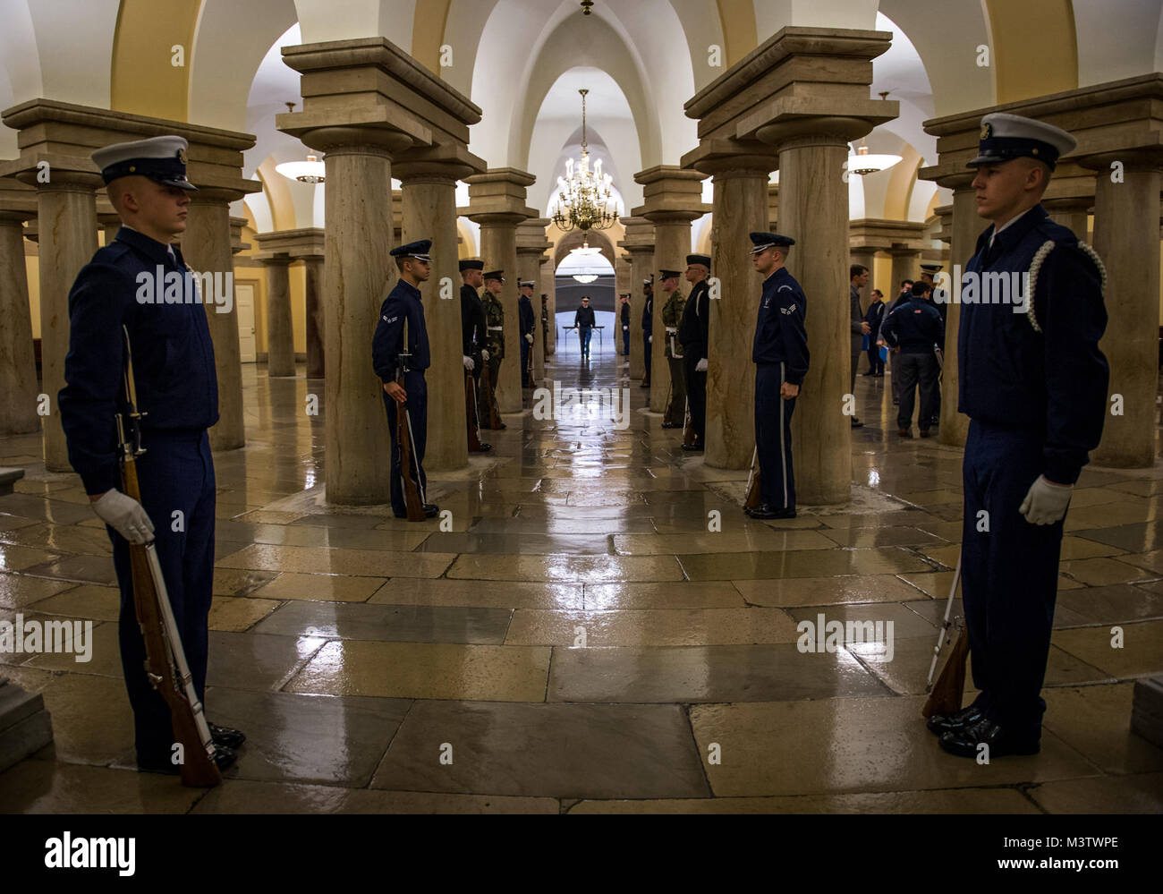 A joint service honor guard cordon stands at attention during the ...