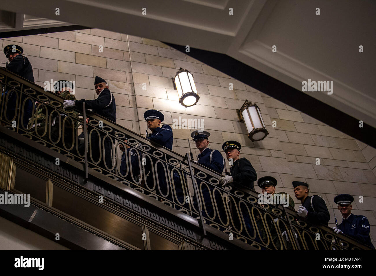 A joint service honor guard cordon wait for their next event during the ...