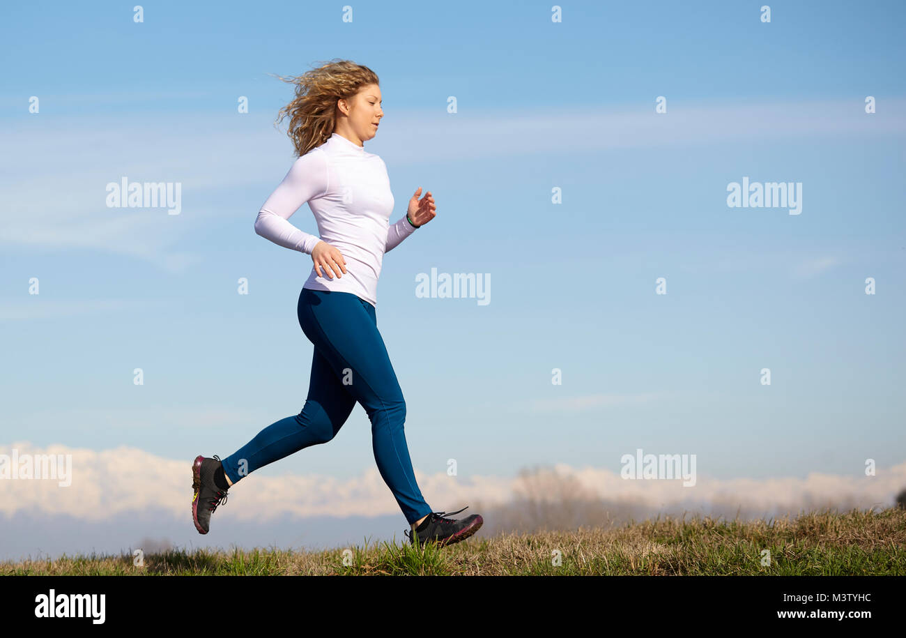 running woman in country environment Stock Photo - Alamy