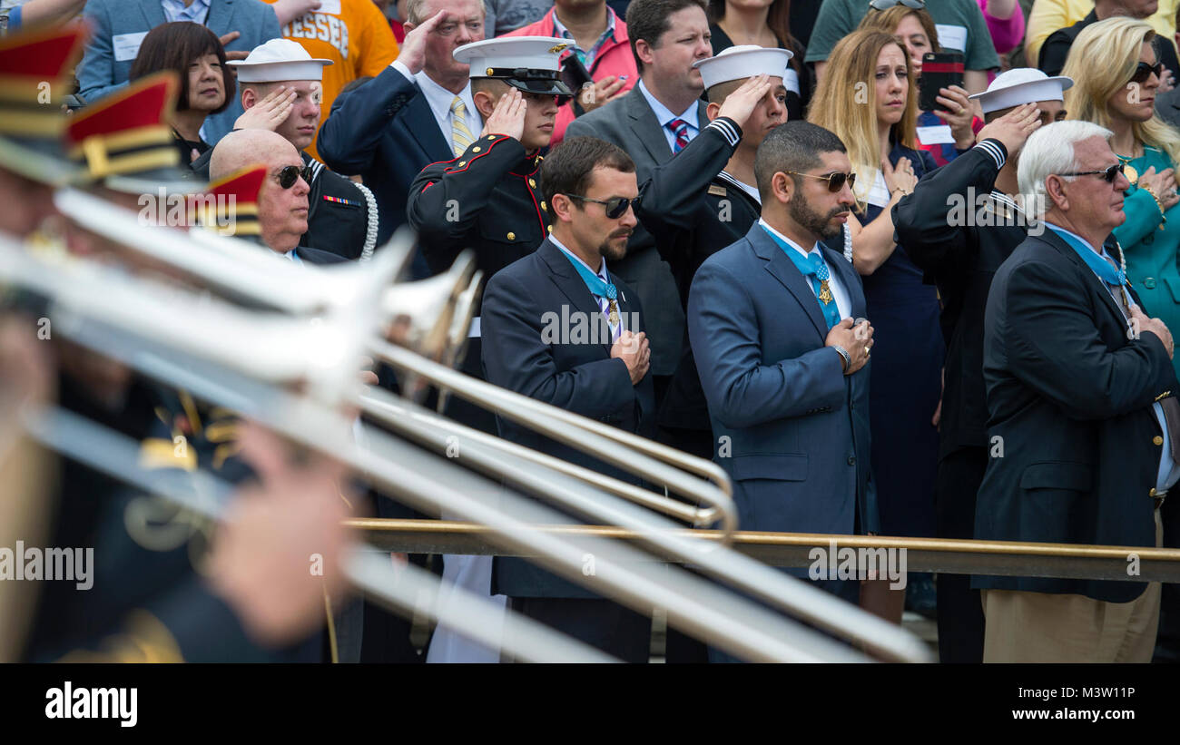 Medal of Honor recipients and service members salute as the National ...