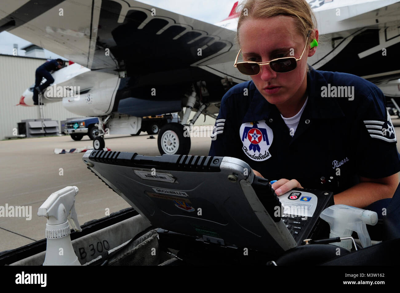 Staff Sgt. Jessica Rivers reviews technical orders while performing ...