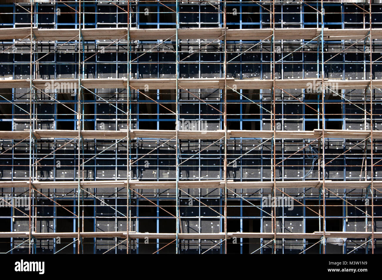 Scaffolding on a construction site of a new building Stock Photo - Alamy