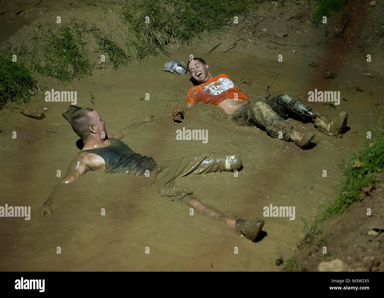 Army Sgt. James Nickelson (left) and Patterson share a laugh as they ...