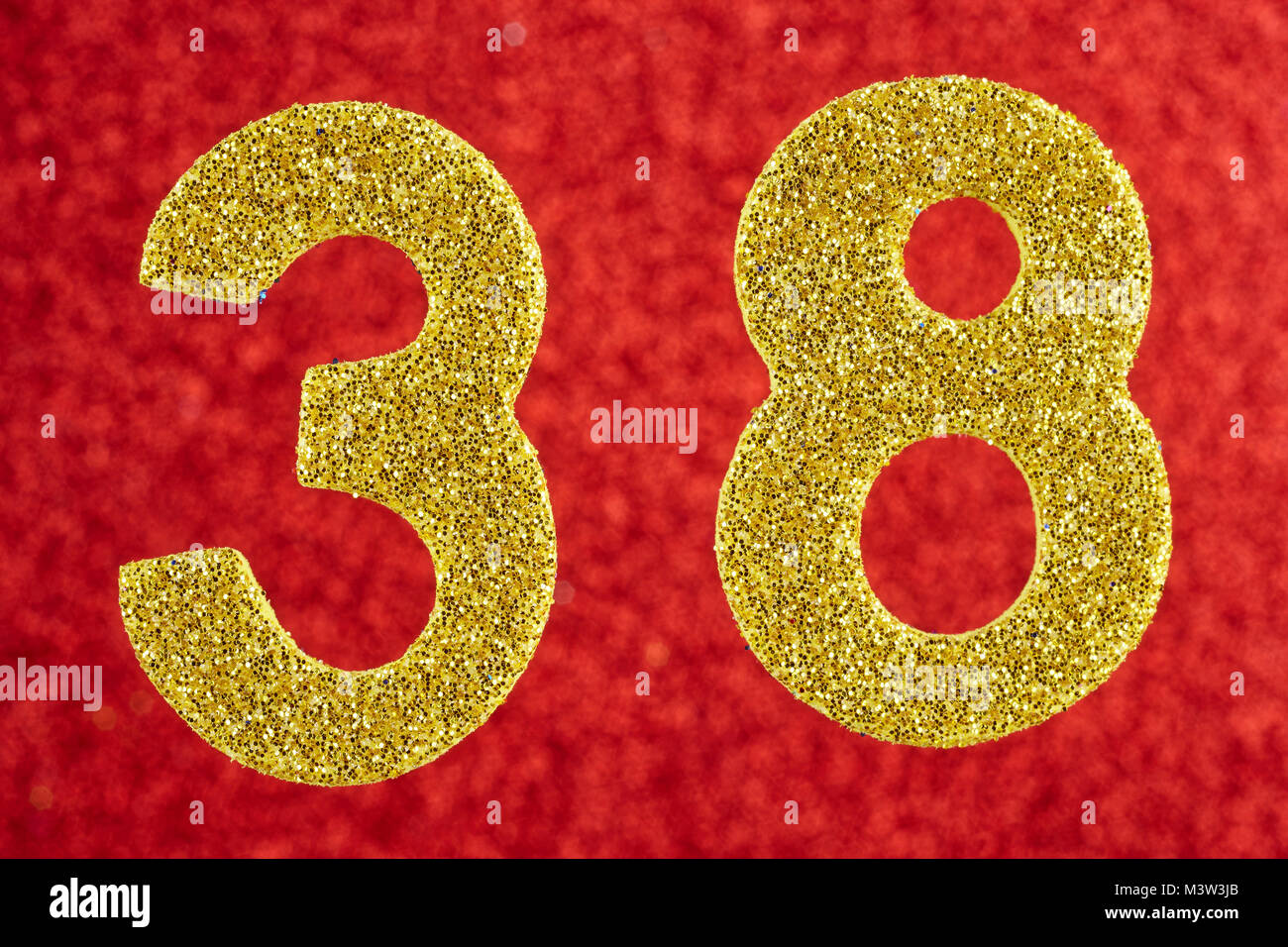 Number thirty-eight gold color over a red background. Anniversary ...
