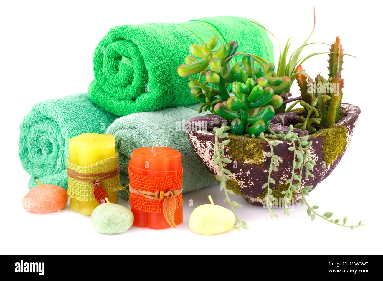 Spa set with towels, candles and plant in vase isolated on white ...