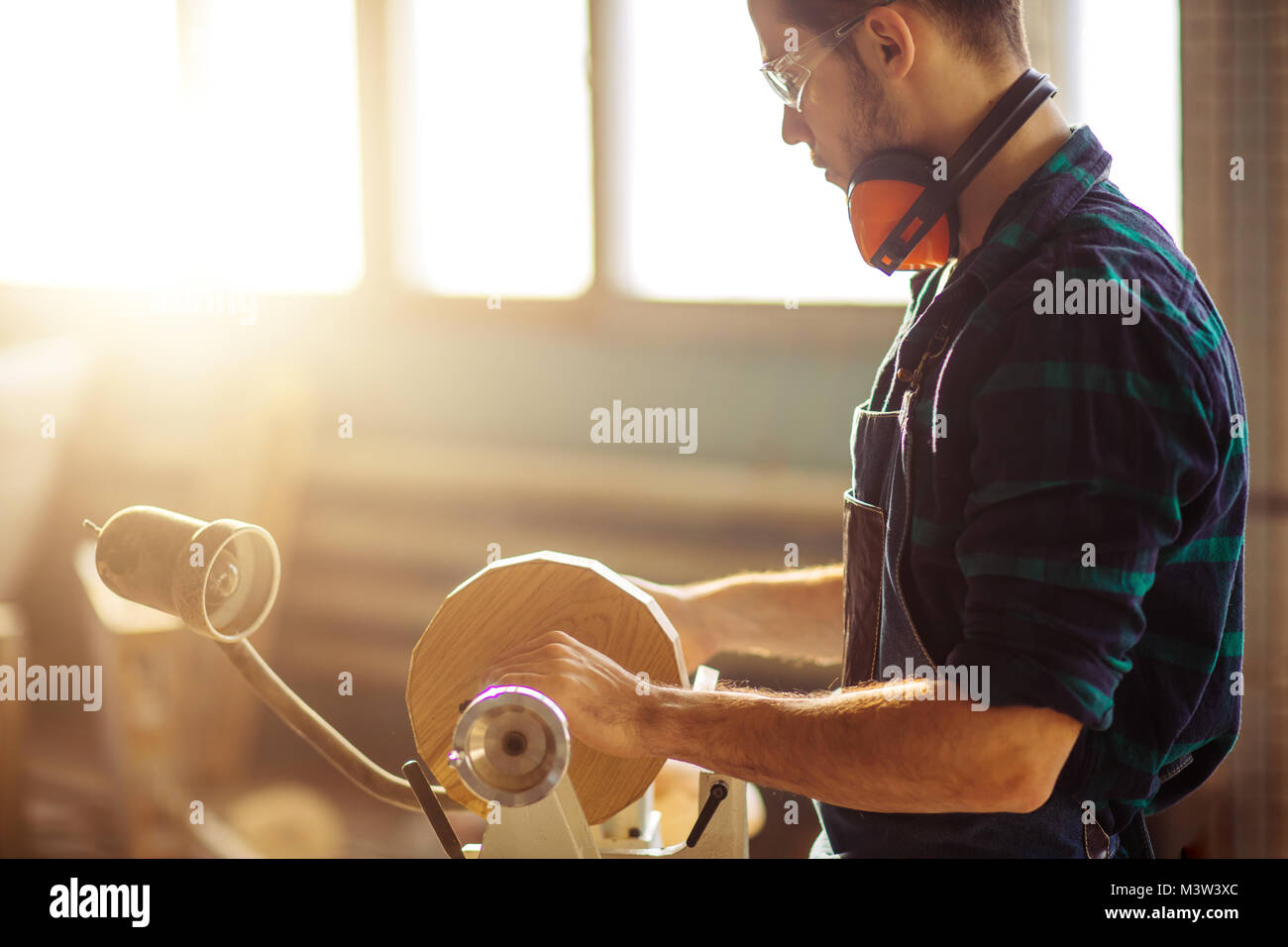 attractive man begin doing woodwork in carpentry Stock Photo - Alamy