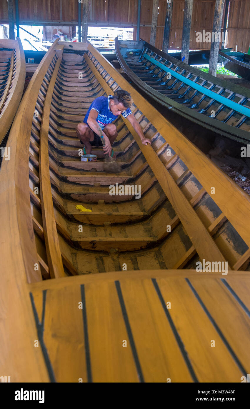 A Burmese man building a boat in Inle lake Myanmar Stock Photo - Alamy