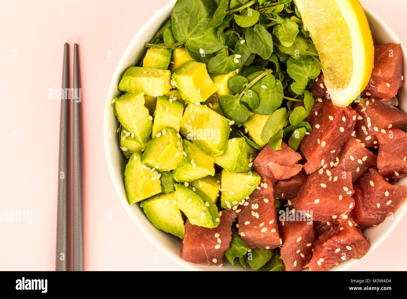 Hawaiian Style Tuna And Avocado Sashimi Poke Food Bowl Against A Light ...