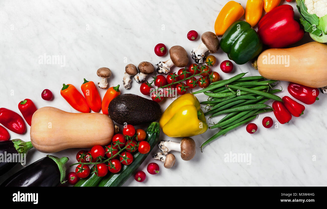 a variety of fresh Vegetables background on a white marble table. place ...