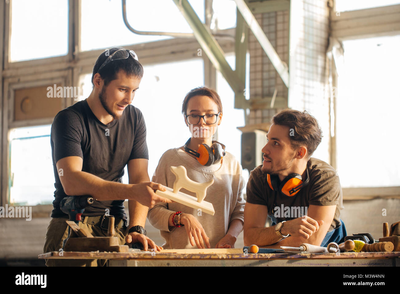 Young carpenter operating machine hi-res stock photography and images ...