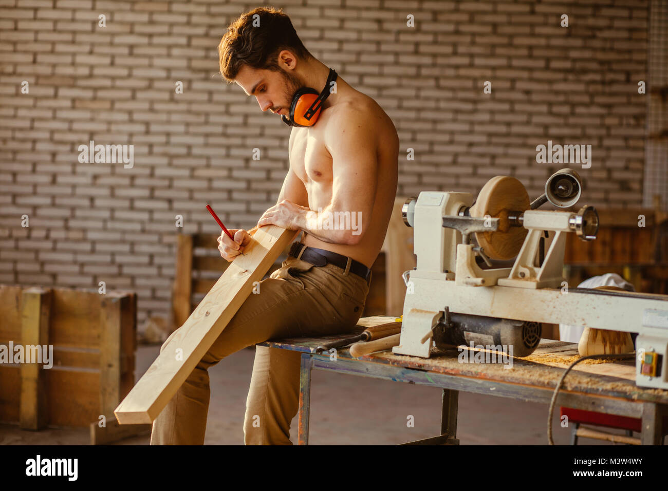 Carpenter hand using pencil draw hi-res stock photography and images ...