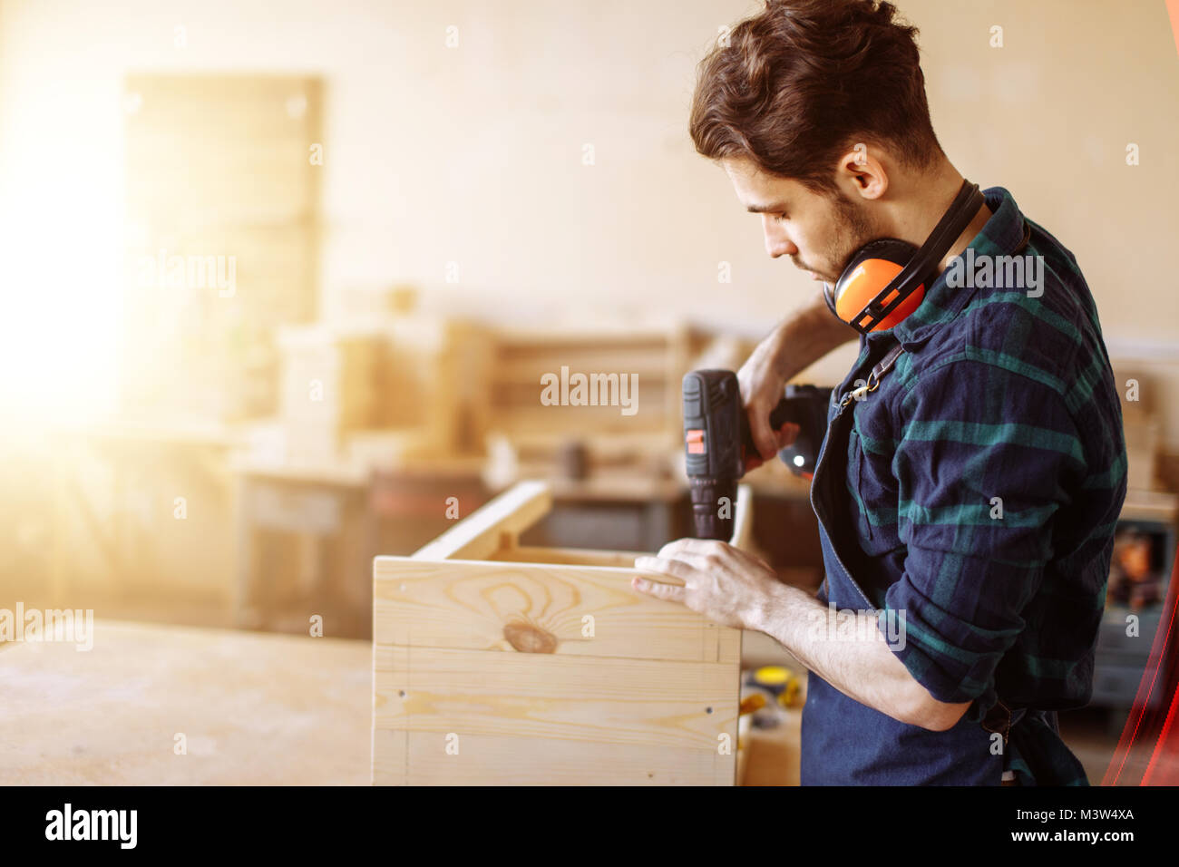 Male hands drill hole in hi-res stock photography and images - Alamy