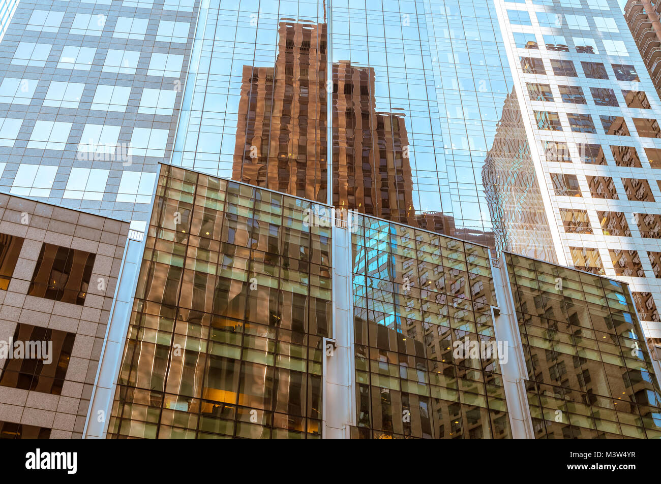 A close up of the reflections on the glass windows of the high rises in ...