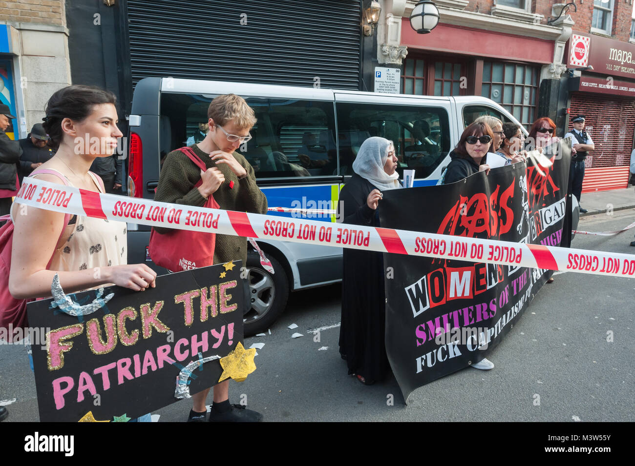 Protesters, including local residents, posed for photographs with ...