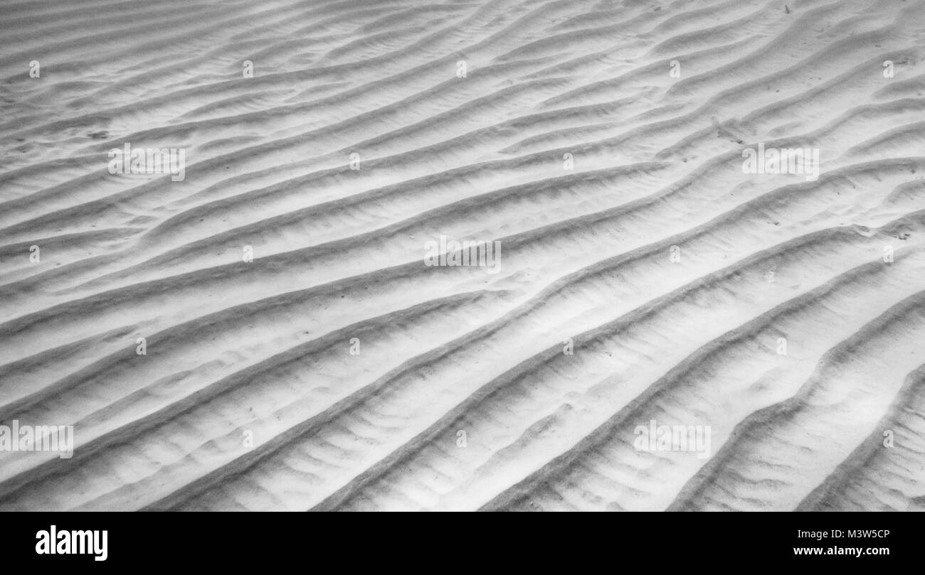 The waves can create amazing pattern in the sandy shallow water Stock ...