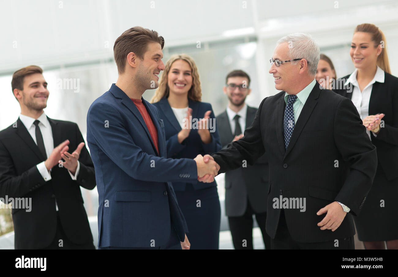 handshake of business partners after a business meeting in the office ...