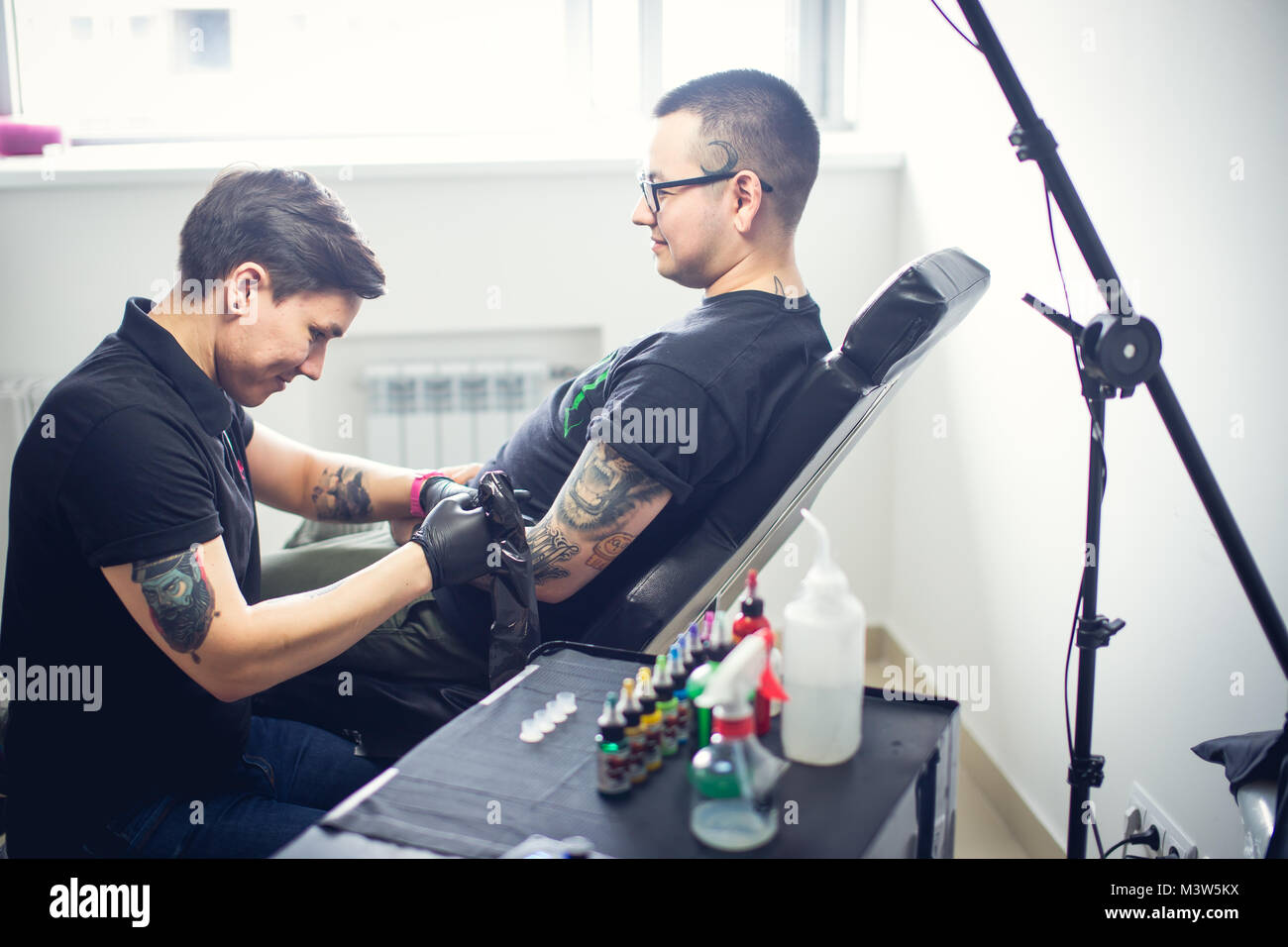 the process of creating a tattoo Stock Photo - Alamy