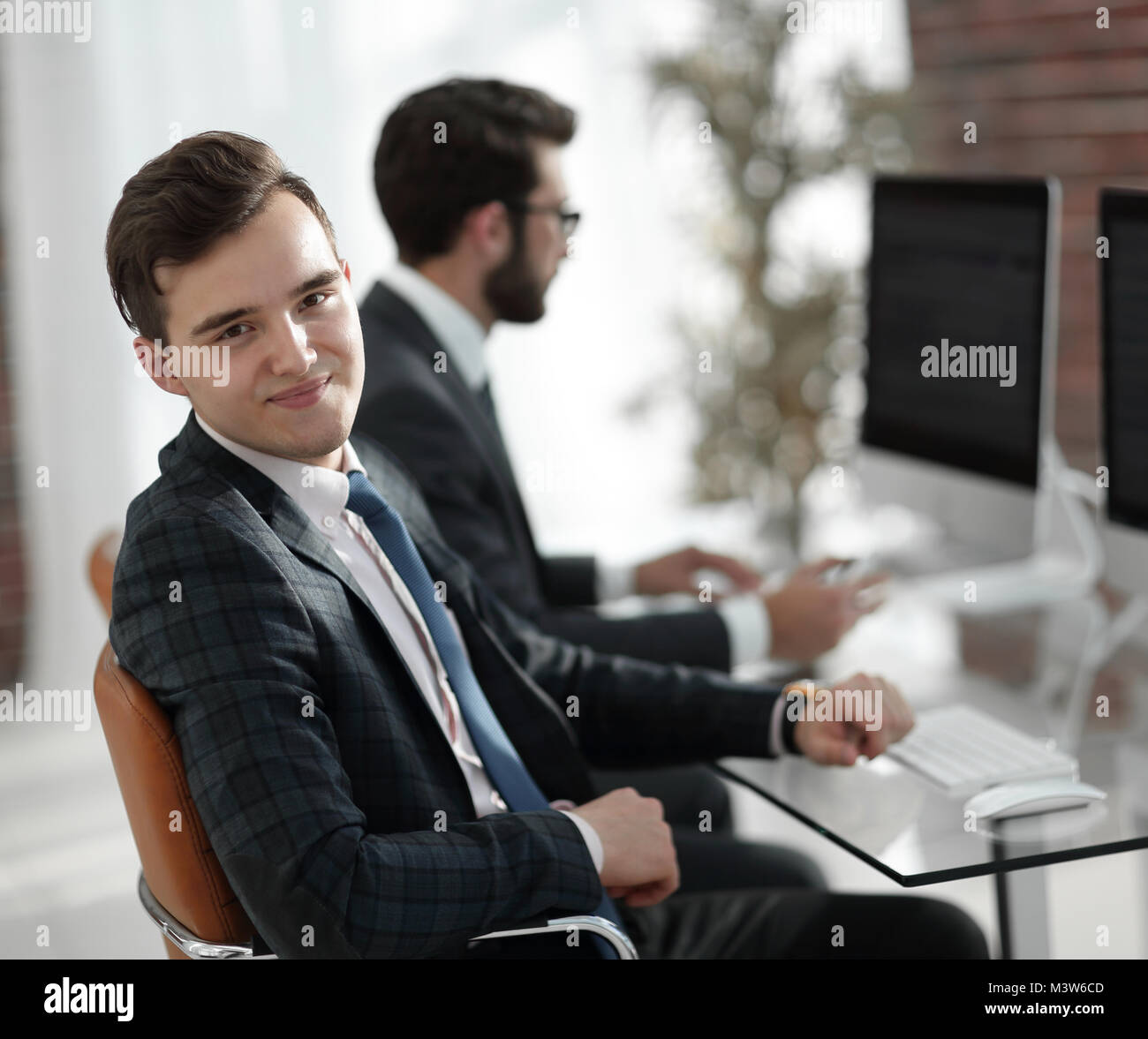 portrait of business man in office Stock Photo - Alamy