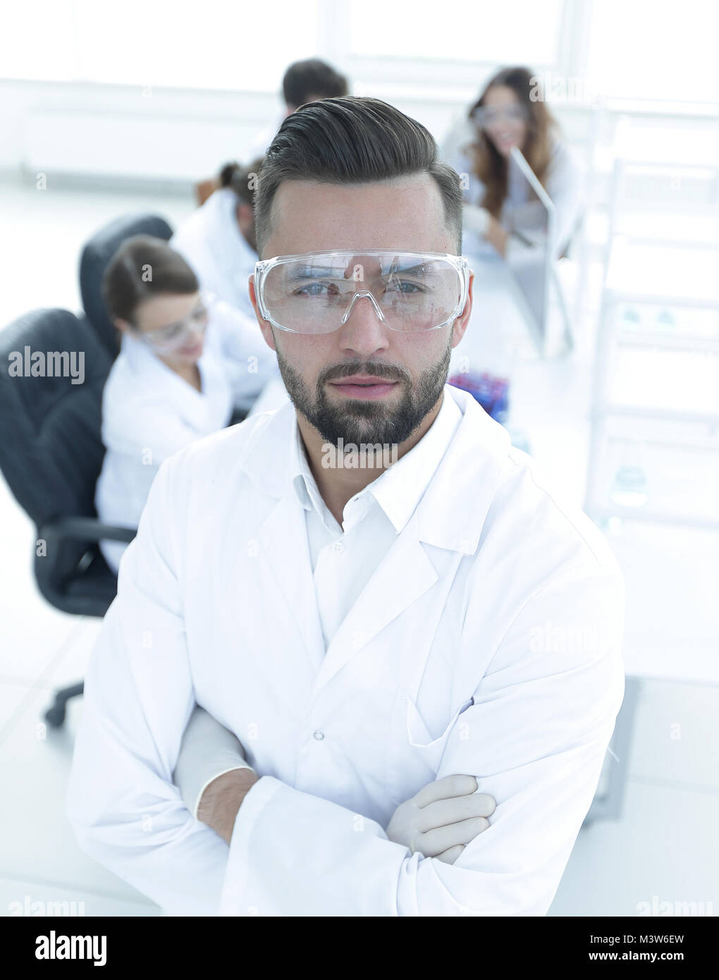 Concentrated laboratory researcher in protective hi-res stock ...