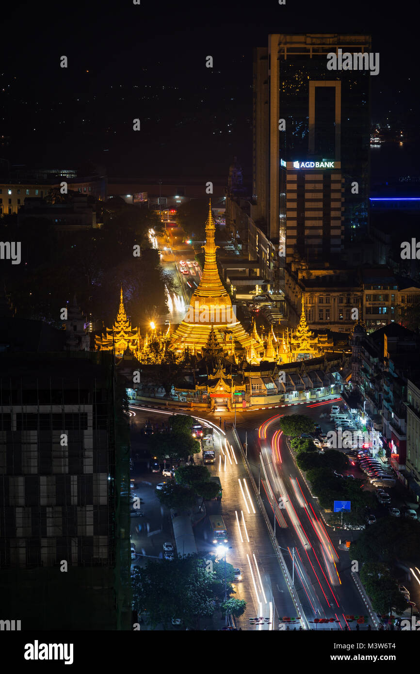 Downtown, Sule Pagoda Road and lit Sule Pagoda in Yangon, Myanmar ...