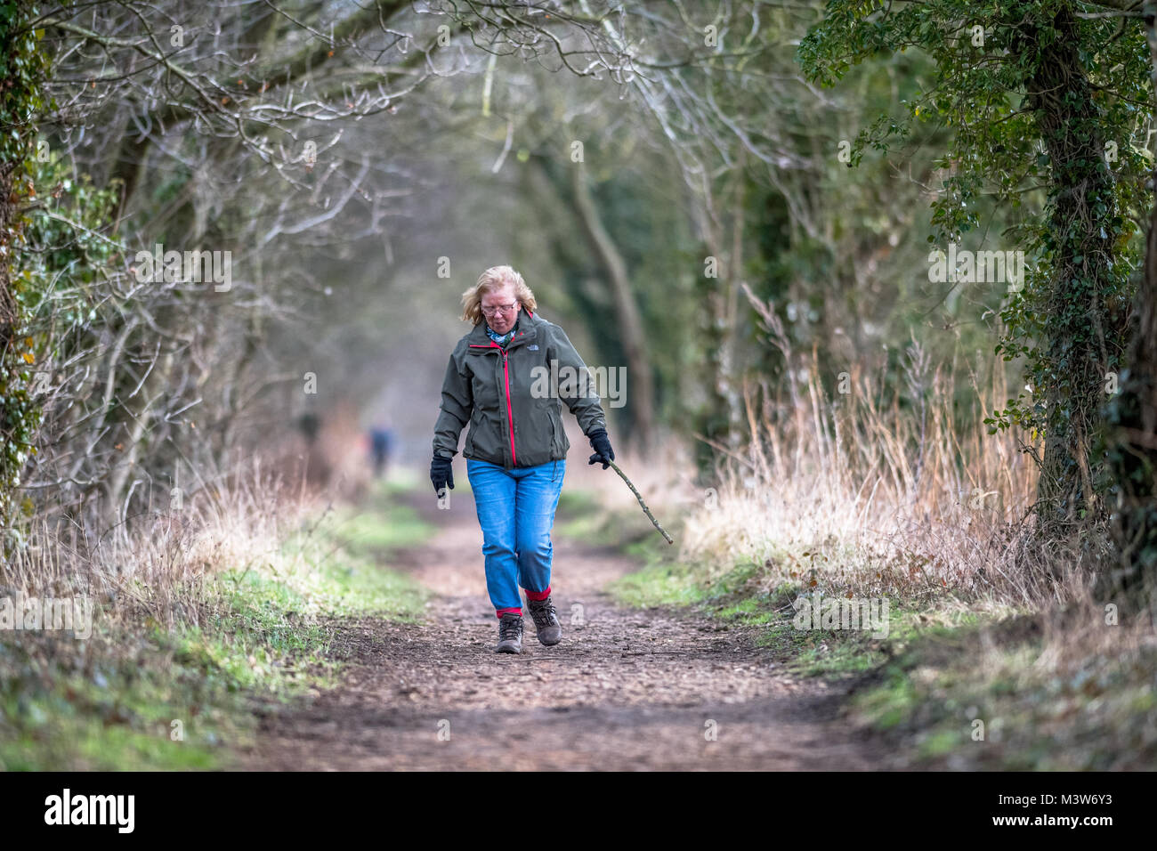 Woman with a stick hi-res stock photography and images - Alamy