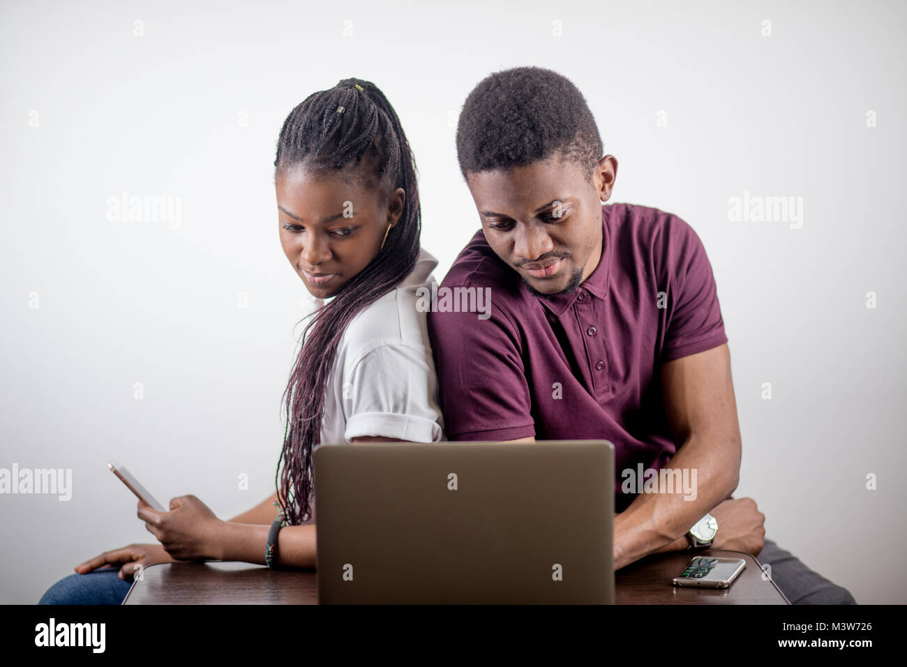 black girl sitting in front of laptop s looking on screen Stock Photo ...