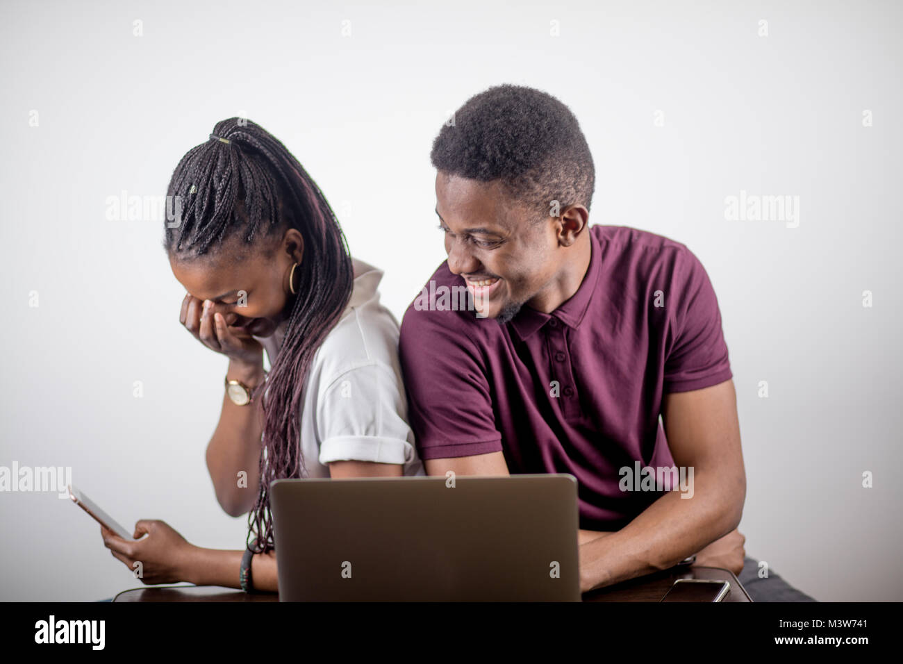 black girl sitting in front of laptop s looking on screen Stock Photo ...
