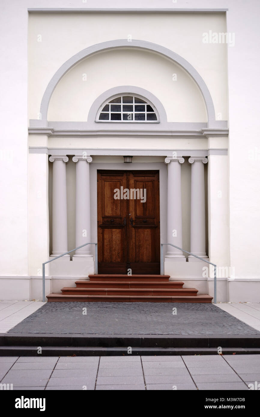 The entrance of a newly built and modern church with an entrance door ...