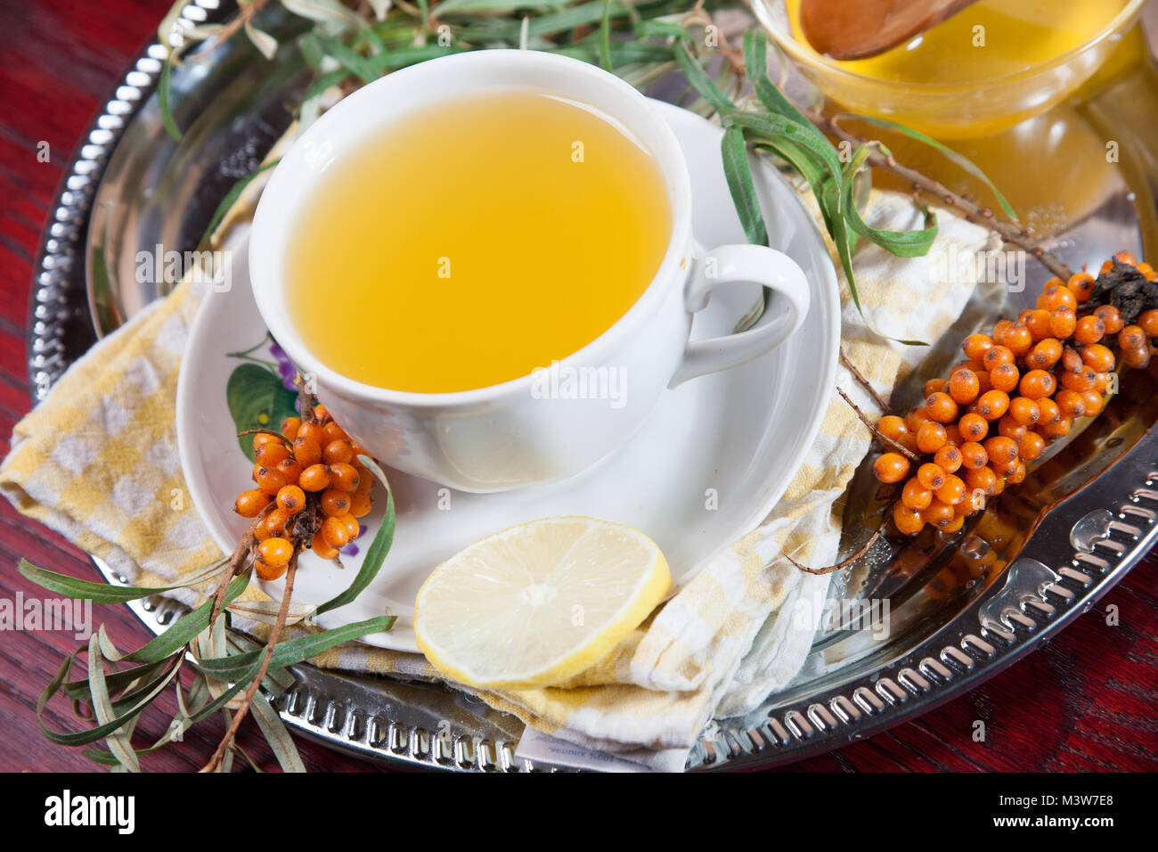 Sea buckthorn tea with a on white background Stock Photo - Alamy
