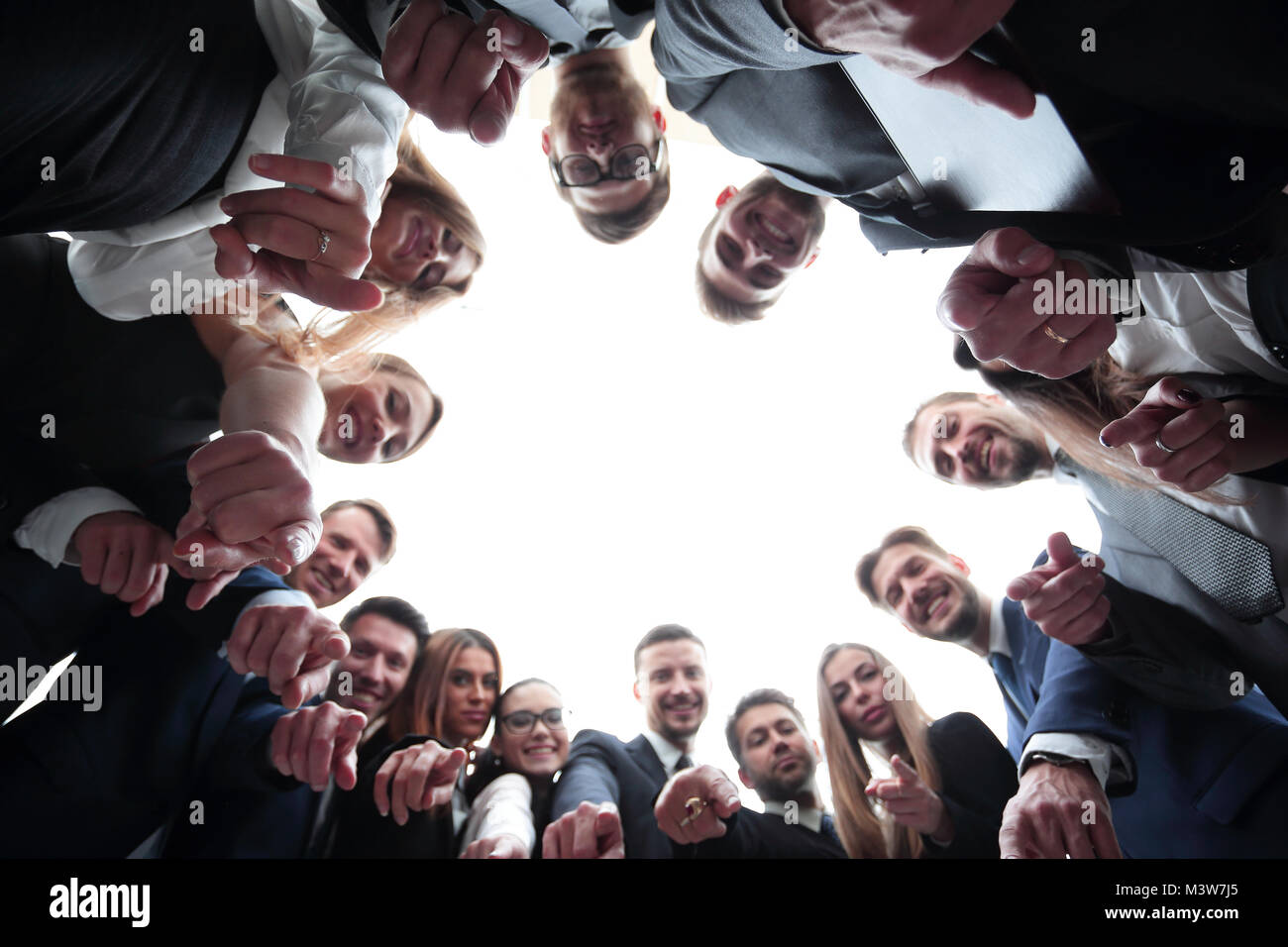 business team is forming a circle and pointing at the camera Stock ...