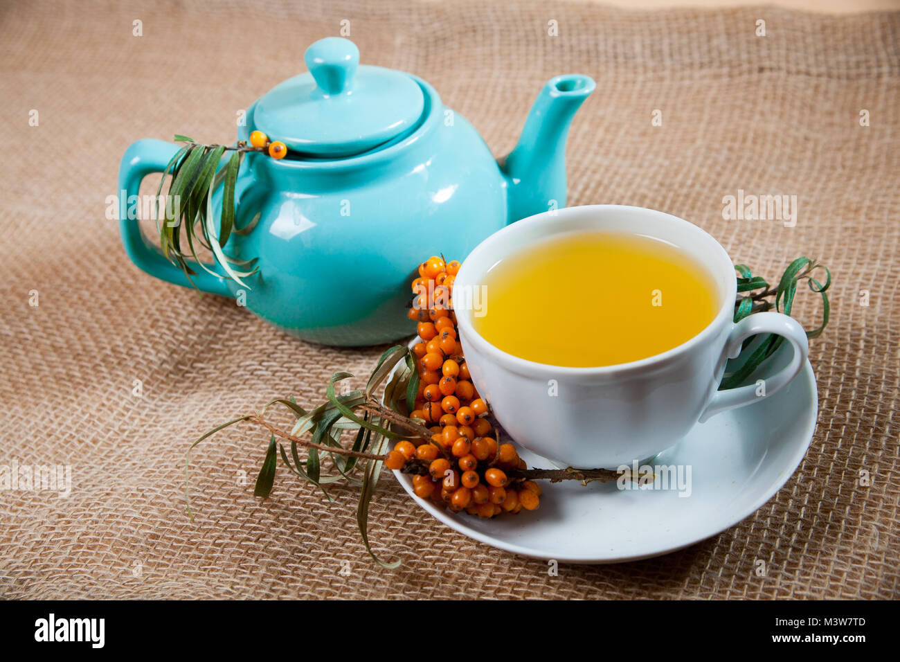 Sea buckthorn tea with a on white background Stock Photo - Alamy