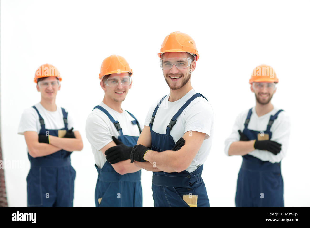smiling team of construction workers Stock Photo - Alamy