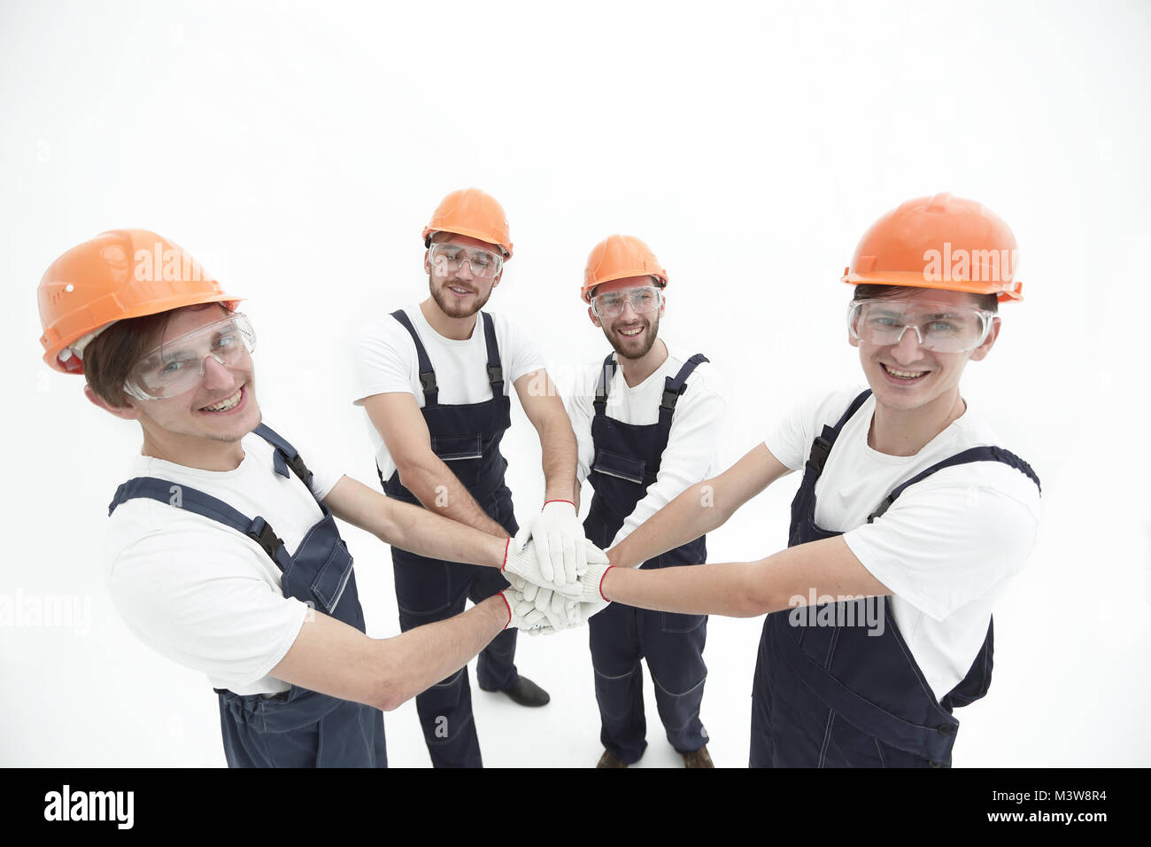 team of builders showing their solidarity Stock Photo - Alamy