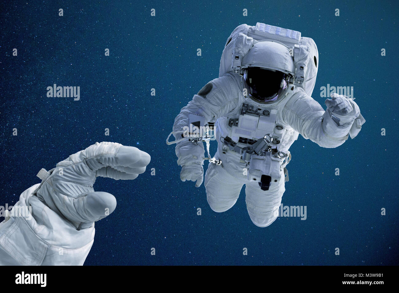Astronaut reaching out for colleague during space walk (3d render ...